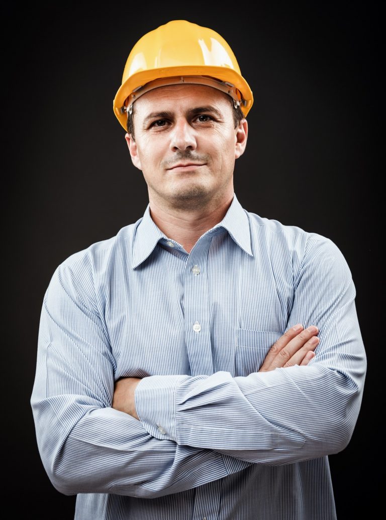 man with construction hat - TradeWind Services LLC